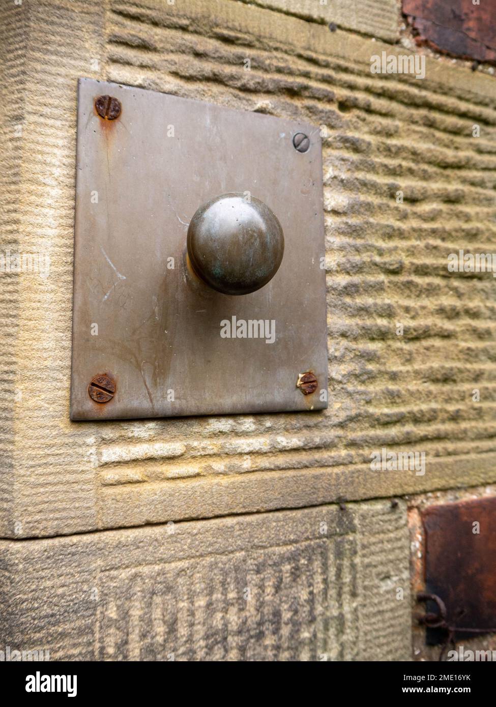 Historical style door furniture, copper handle fixed to the wall to aid ...