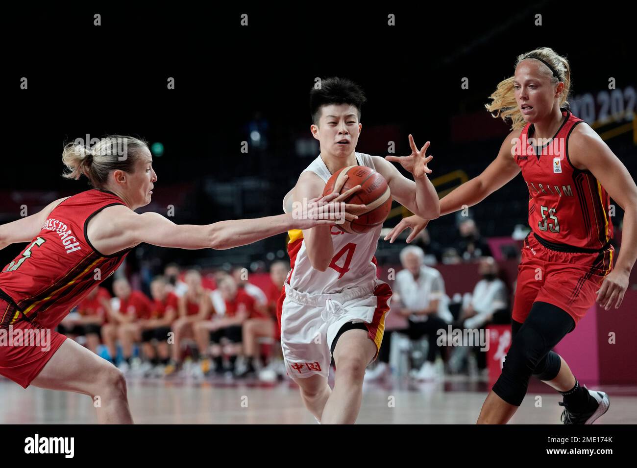 China's Yuan Li (4) drives to the basket between Belgium's Kim Mestdagh ...
