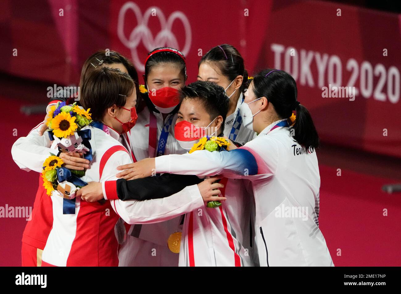 From left: Silver medalist China's Chen Qing Chen and Jia Yi Fan, gold medalists Greysia Polii ...