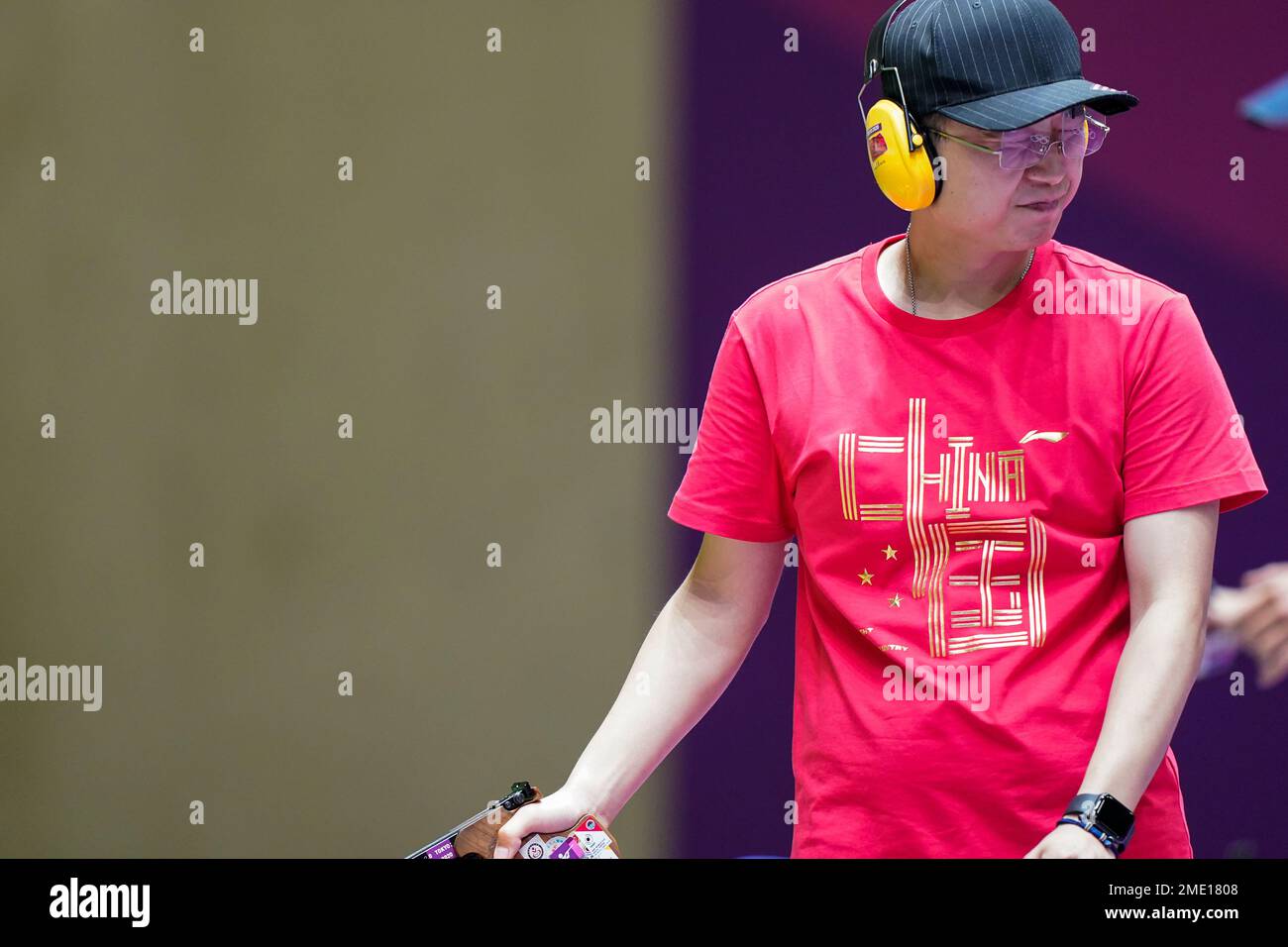 Li Yuehong, of China, reacts after his last shot as he competes in the ...
