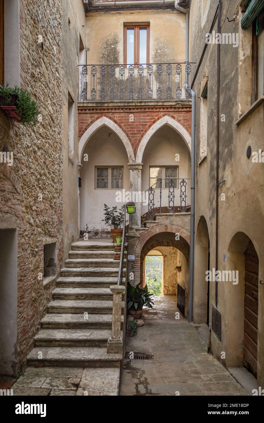 Inner courtyard of stone buildings in medieval hilltop hamlet of ...