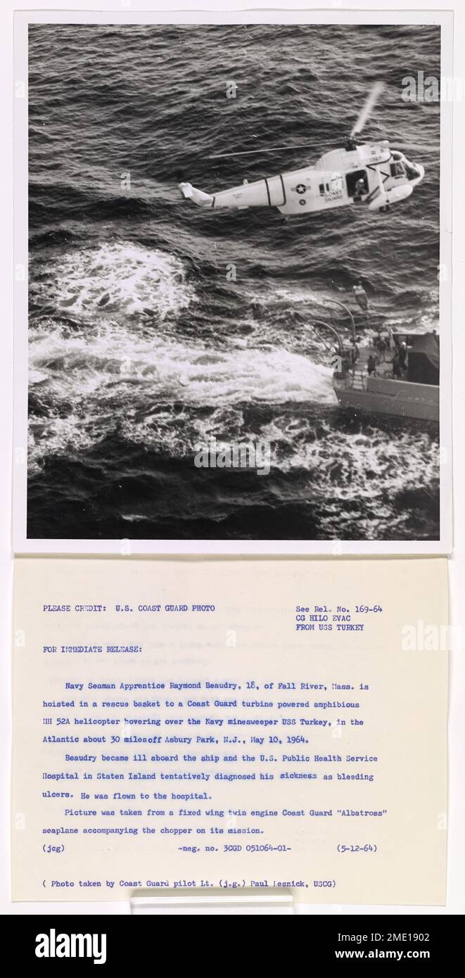 A Coast Guard helicopter rescues an ill sailor, Raymond Beaudry, from ...