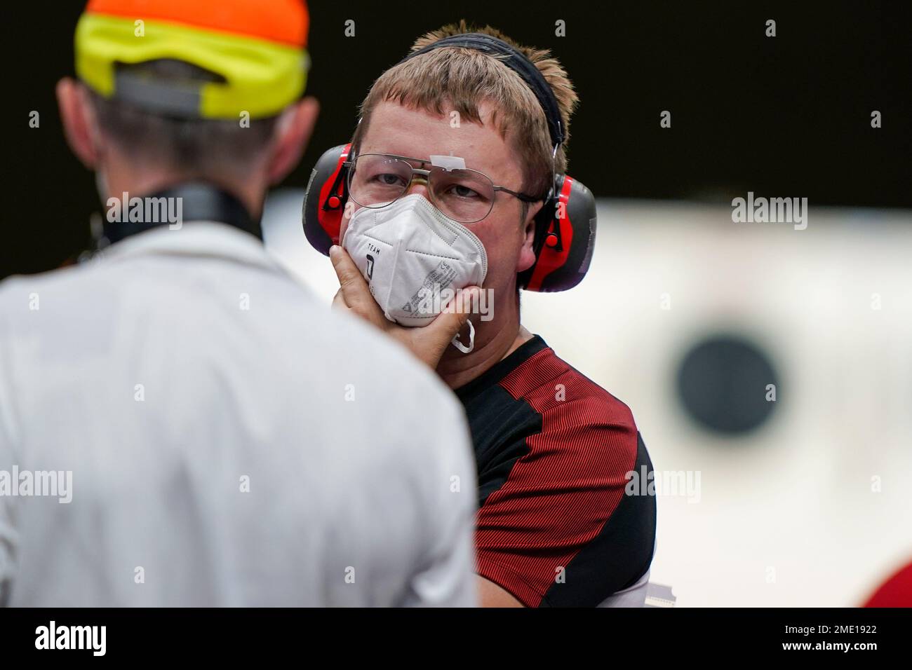 Christian Reitz, right, of Germany, speaks with his coach as he ...
