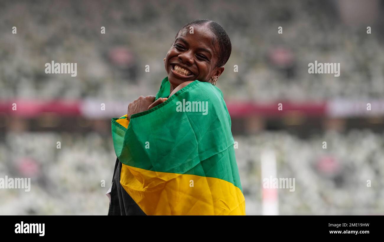 Megan Tapper, of Jamaica, reacts after the women's 100-meters hurdles ...