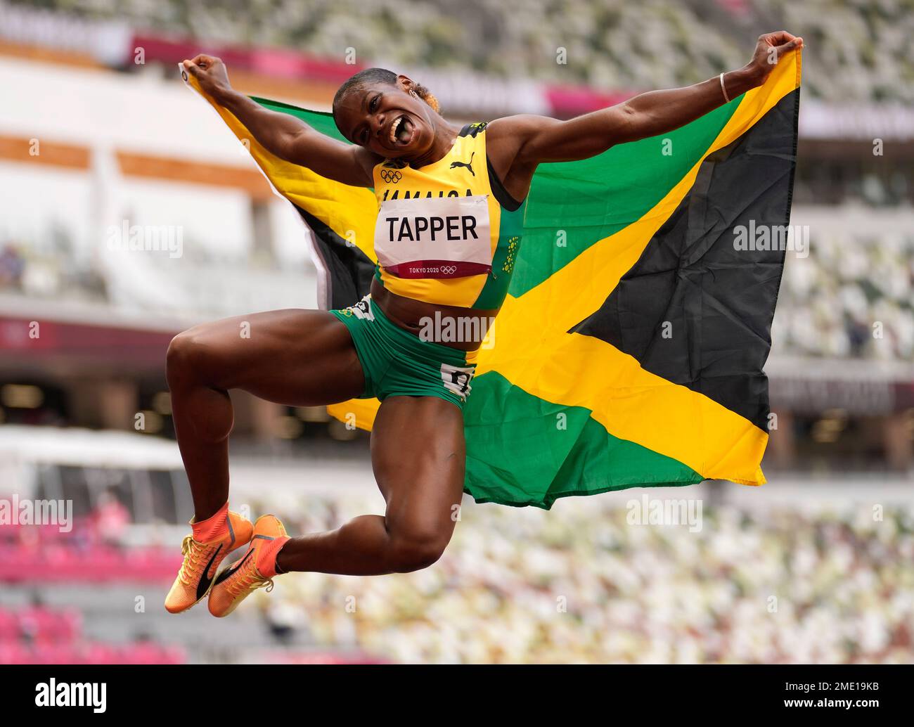 Megan Tapper, of Jamaica celebrates after winning the bronze medal in ...