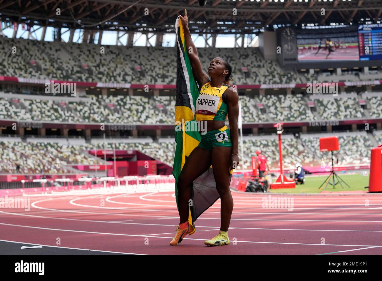 Megan Tapper, of Jamaica, reacts after winning bronze in the women's ...