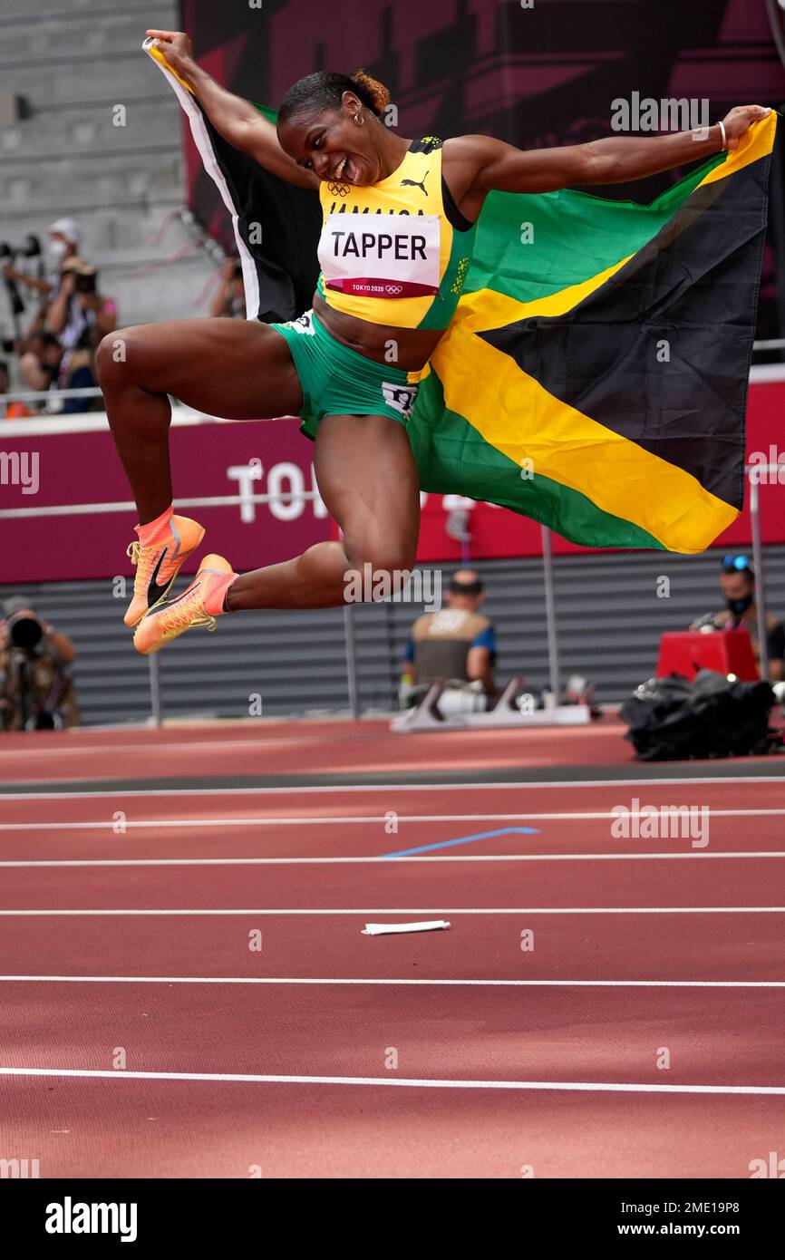 Megan Tapper, of Jamaica, poses after winning the silver medal in the ...