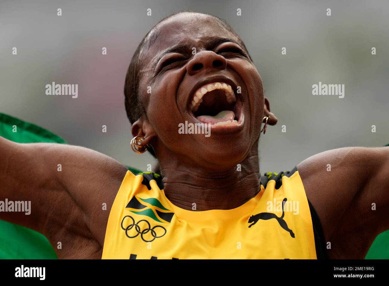 Megan Tapper, of Jamaica, reacts after the women's 100-meters hurdles ...