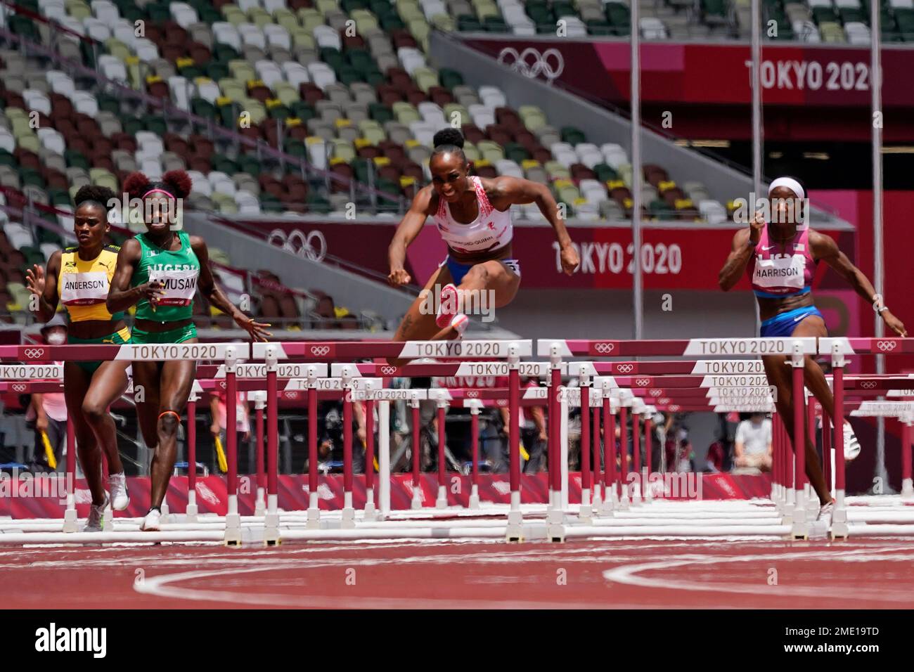 Jasmine Camacho-Quinn, of Puerto Rico, jumps the final hurdle on her way to winning the women's ...