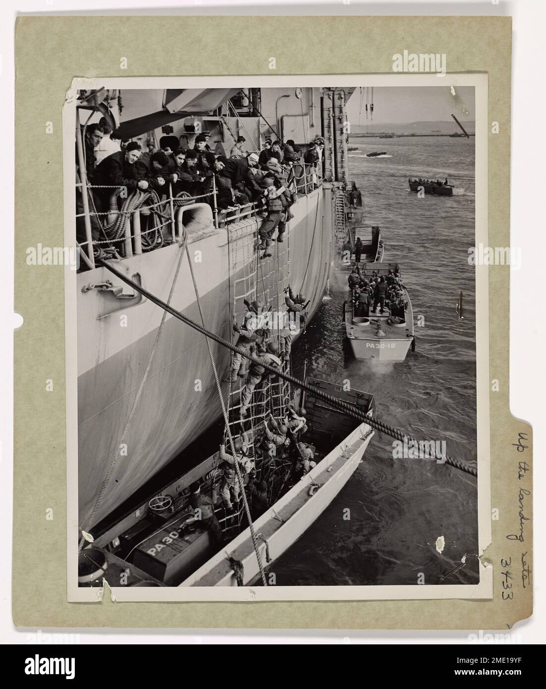A Coast Guard-manned assault transport arrives at a British port, where ...