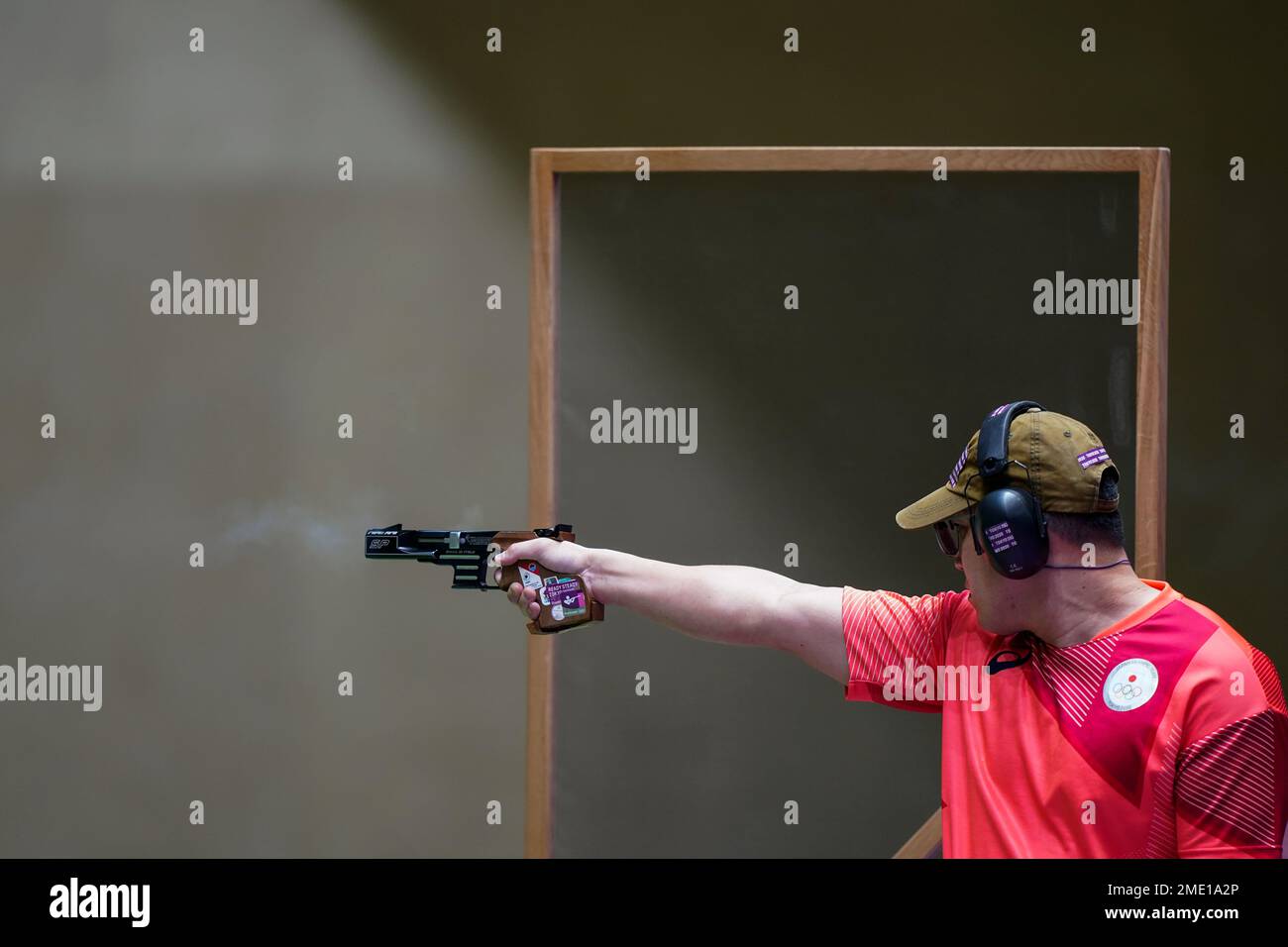 Dai Yoshioka, of Japan, competes in the men's 25-meter rapid fire ...