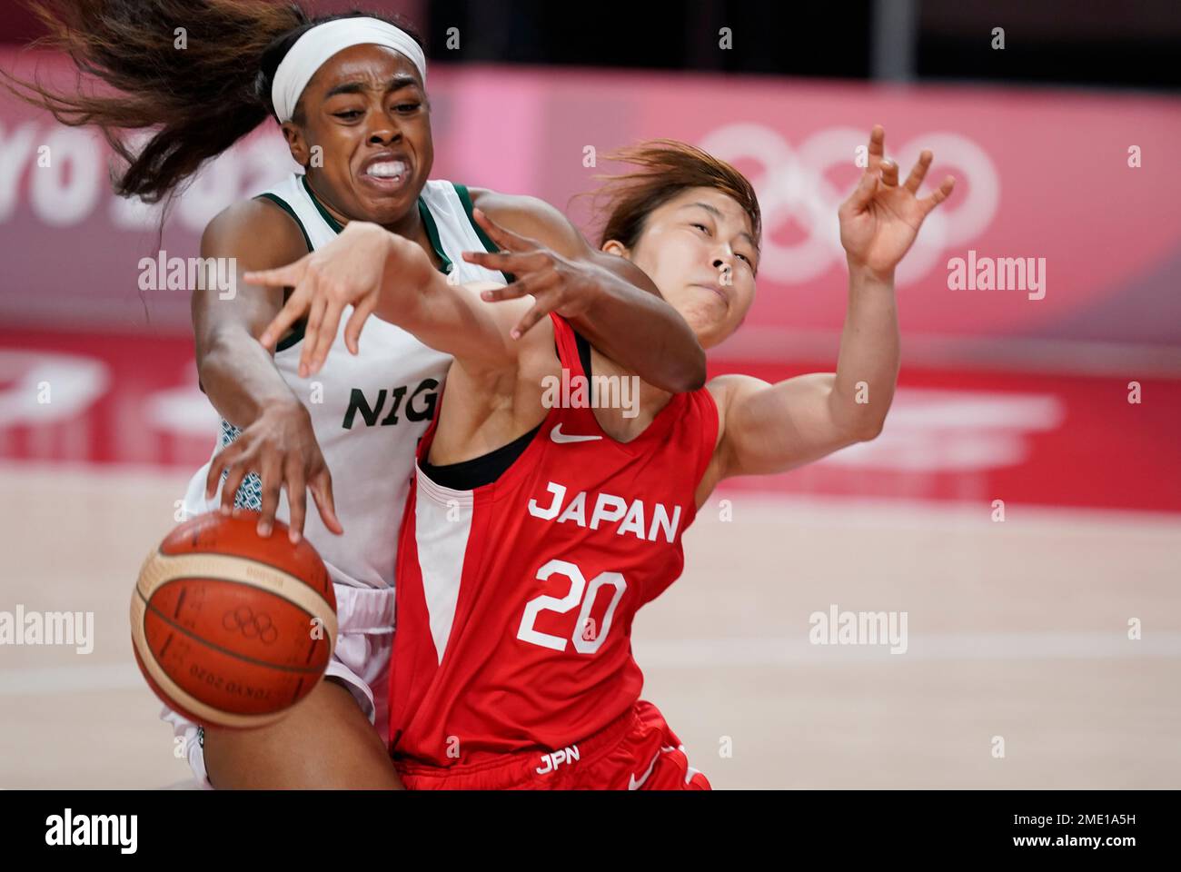 Nigeria's Erinma Ogwumike (31, left, tries to steal the ball from Japan ...