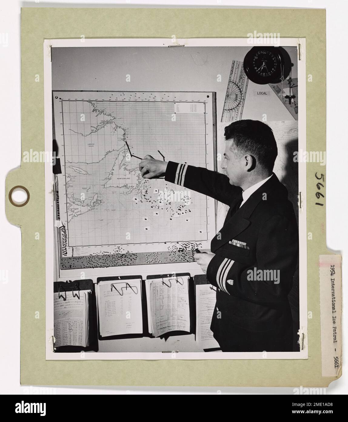 Lieut. Commander Armand J. Bush of the U.S. Coast Guard plots the ...