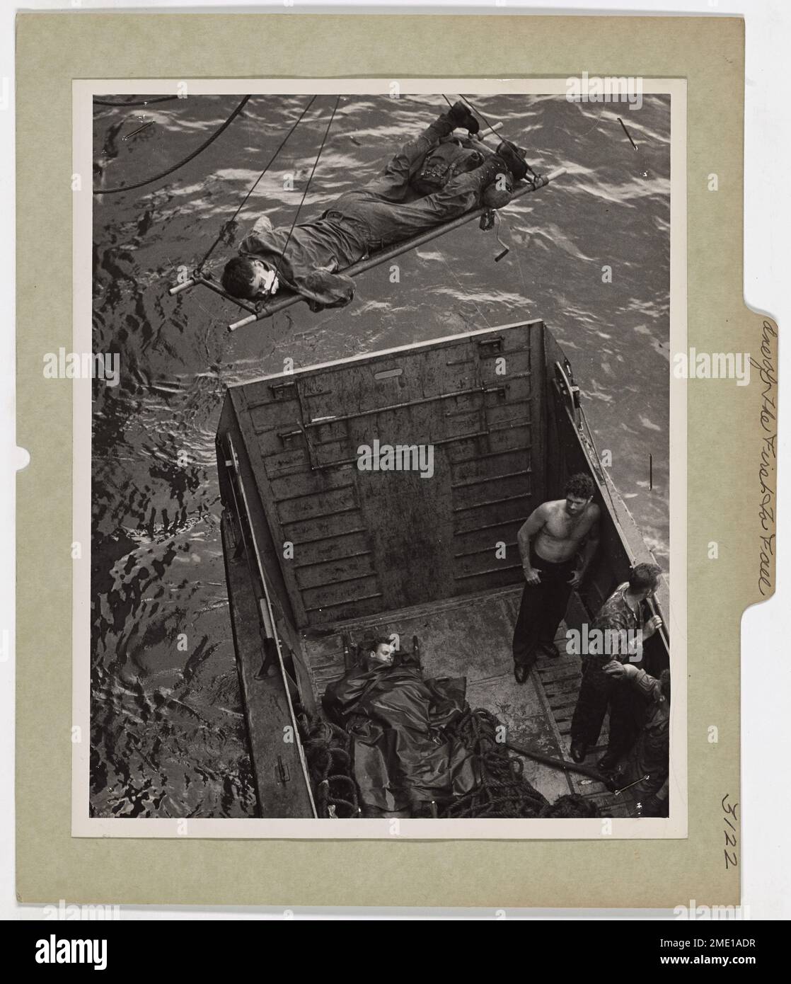 A wounded American soldier is hoisted aboard a Coast Guard-manned ...