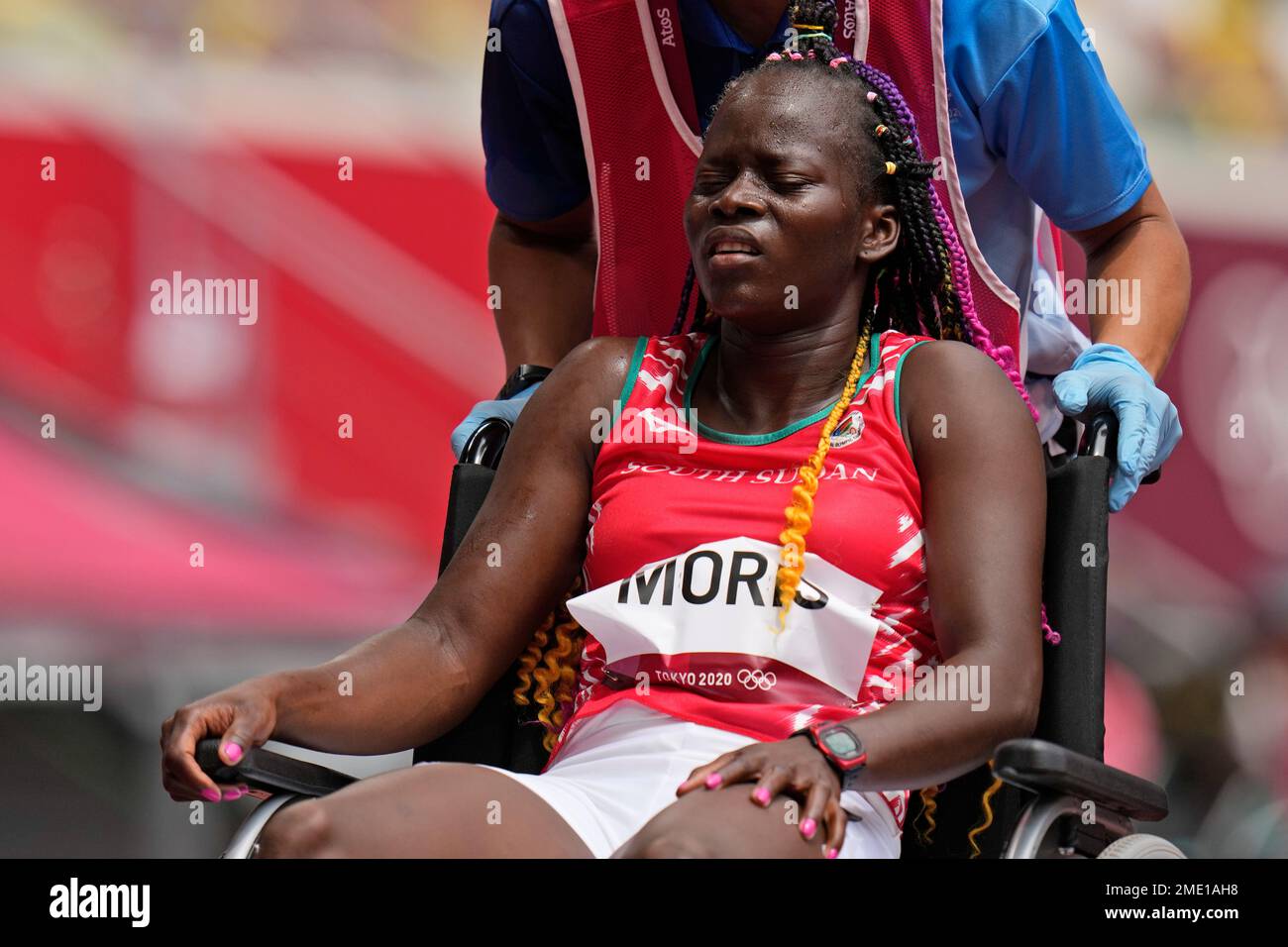 Lucia Moris, of South Sudan, is taken from the track in a wheelchair ...