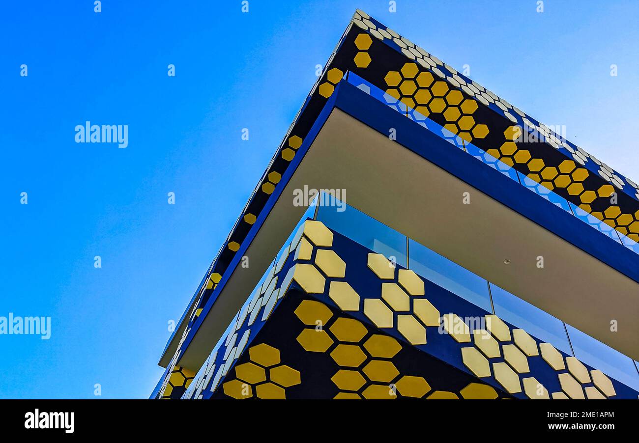 Yellow hotel building in honeycomb design in Playa del Carmen Quintana ...