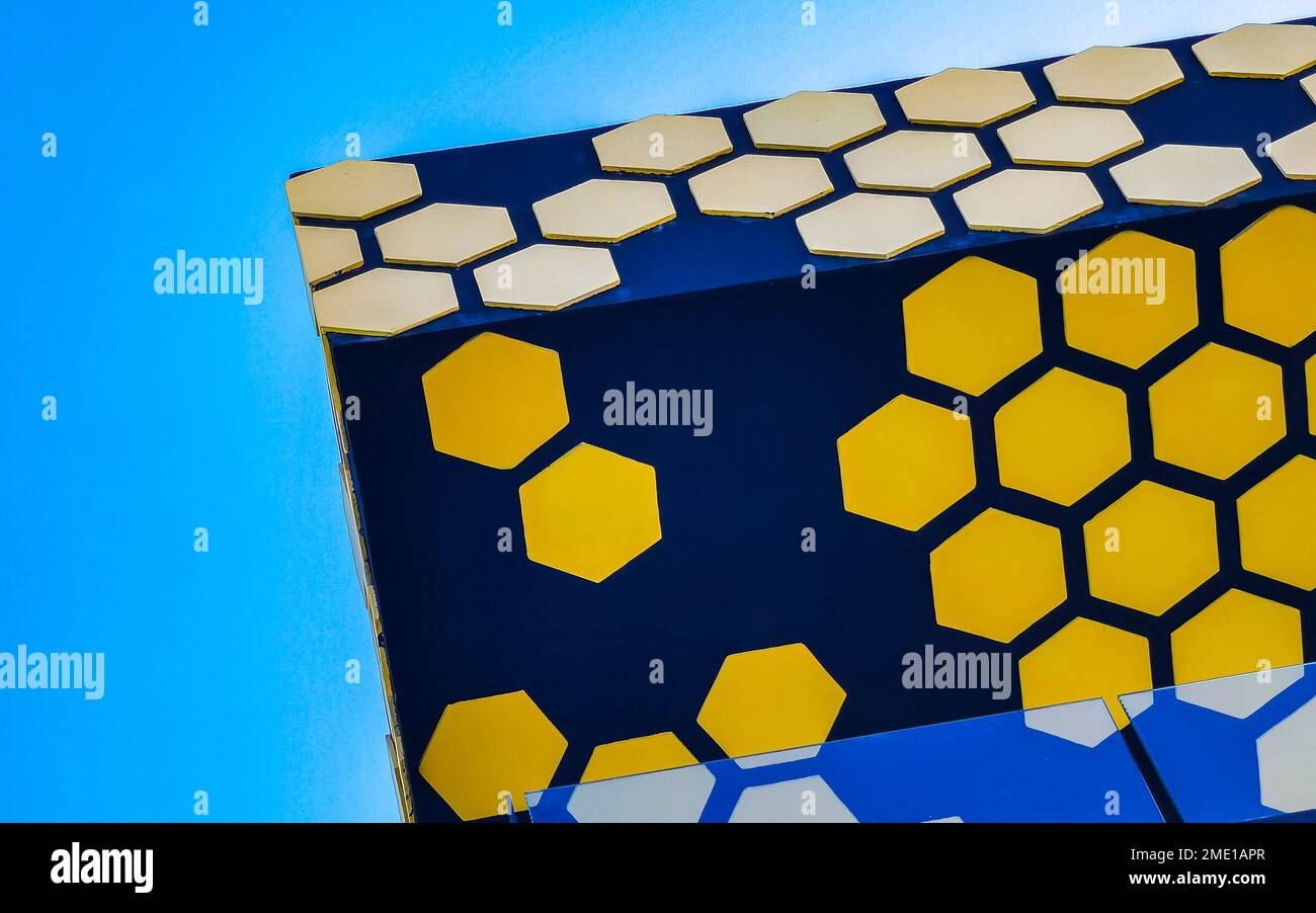 Yellow hotel building in honeycomb design in Playa del Carmen Quintana ...