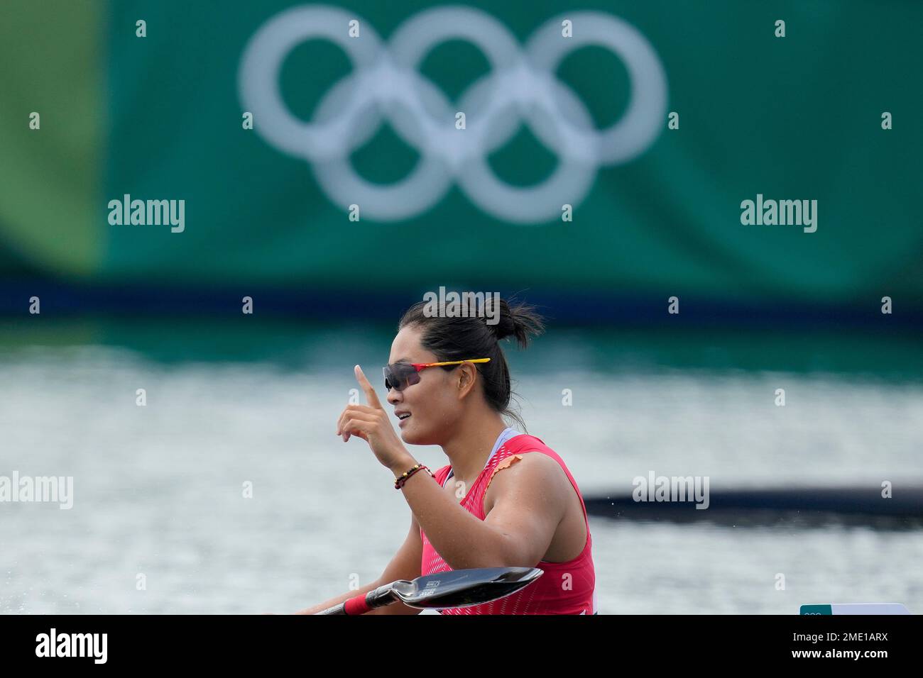 Yin Mengdie of China reacts after competing in the women's kayak single ...