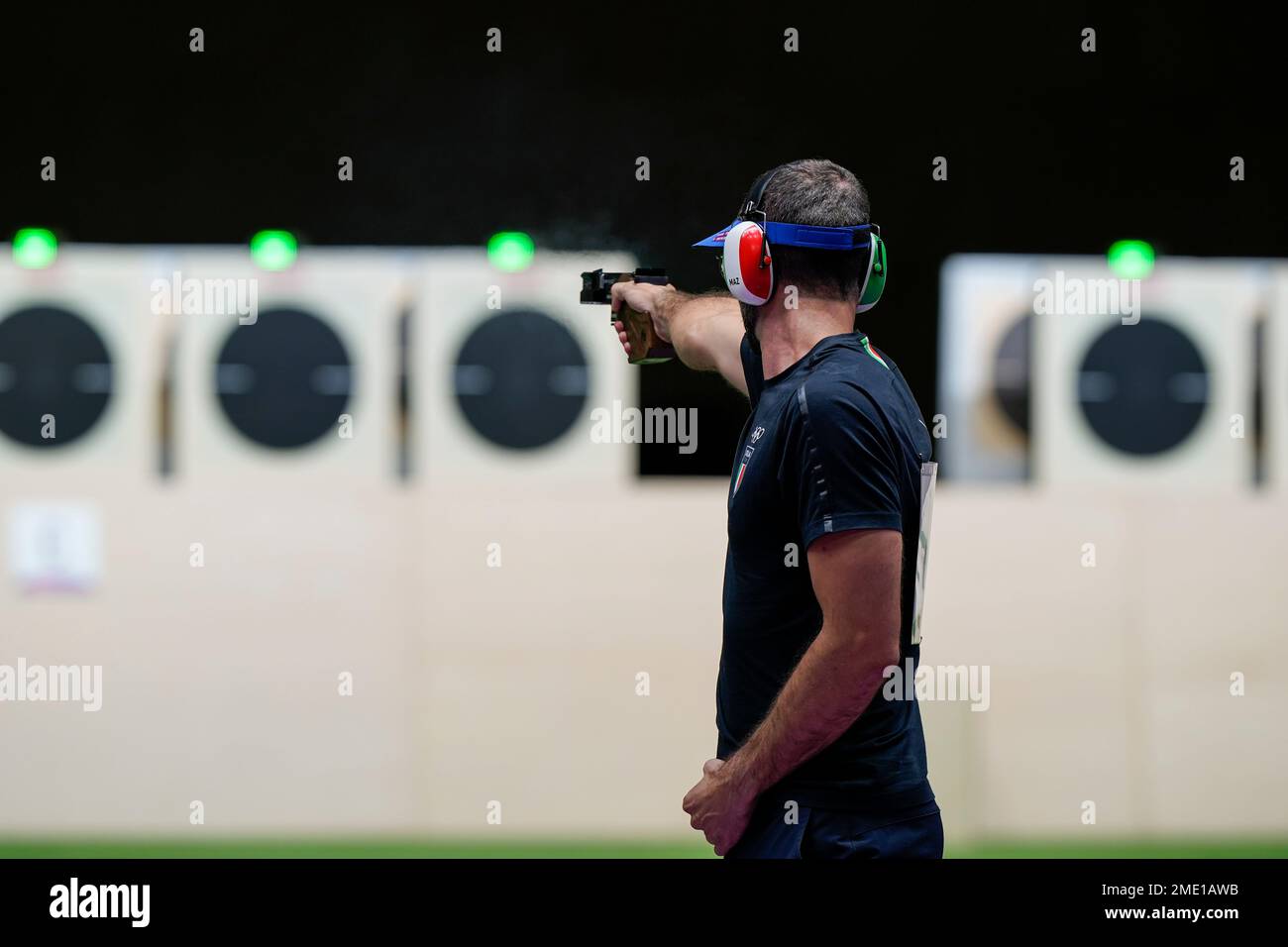 Riccardo Mazzetti, of Italy, competes in the men's 25-meter rapid fire ...