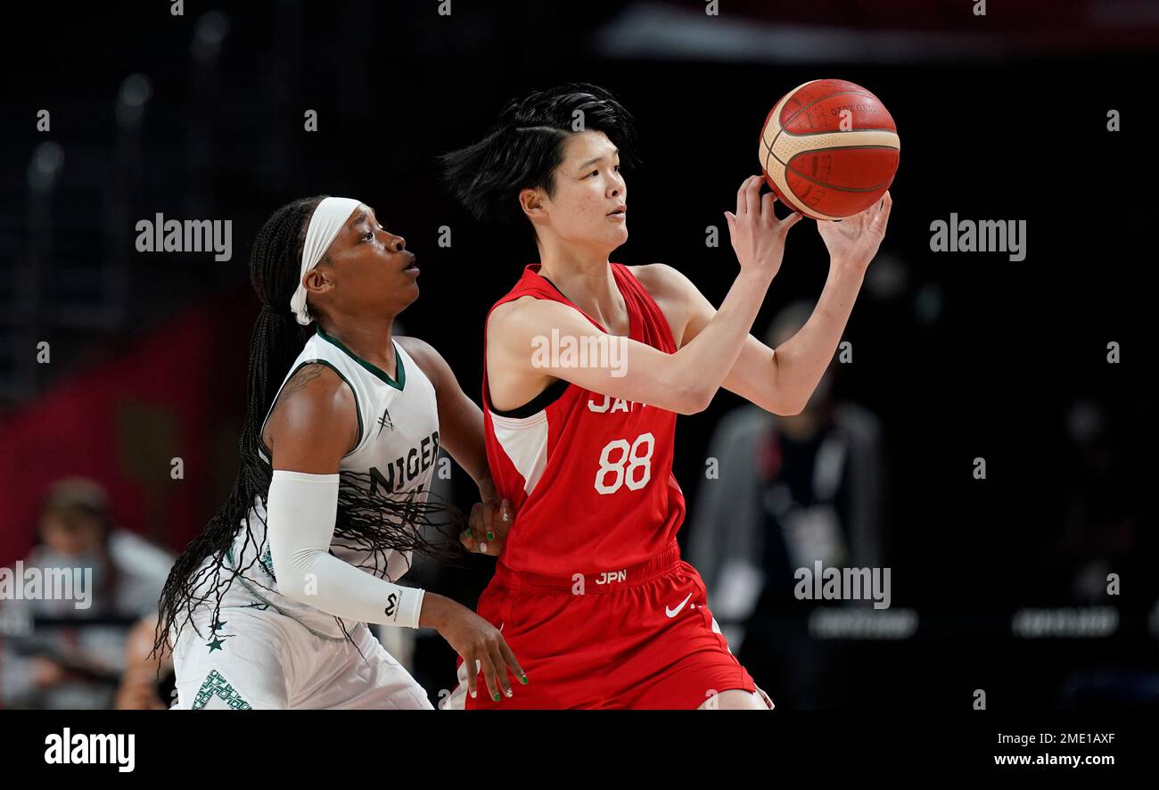 Japan's Himawari Akaho (88), right, passes around Nigeria's Victoria ...