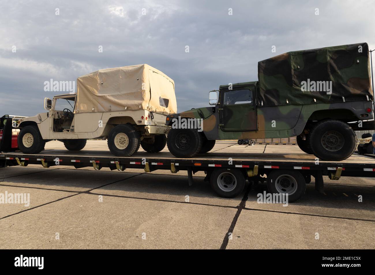 Two Humvees are loaded and ready to move from the 1st Theater ...
