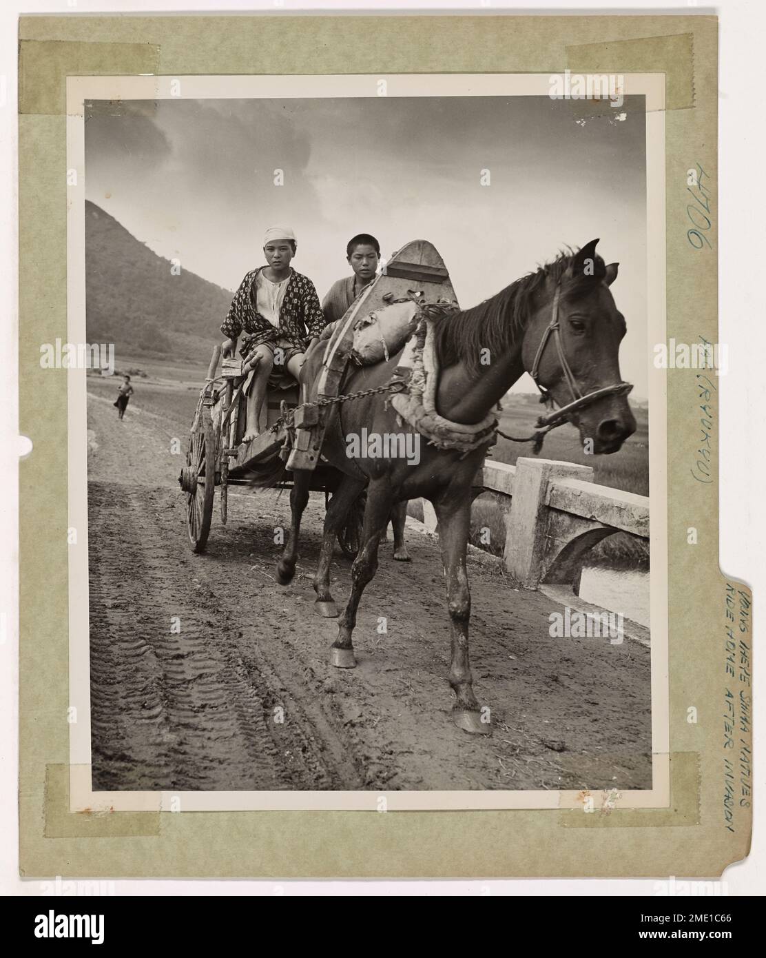 The image shows two young Japanese natives from Iheya Shima, Ryukyu ...