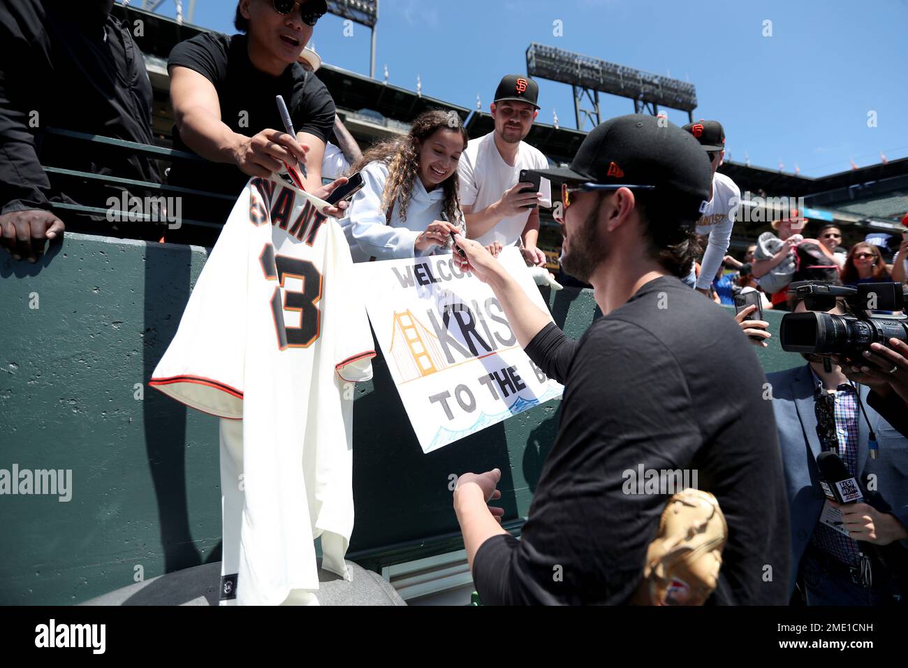San Francisco Giants' Kris Bryant gives autographs to fans prior to a ...