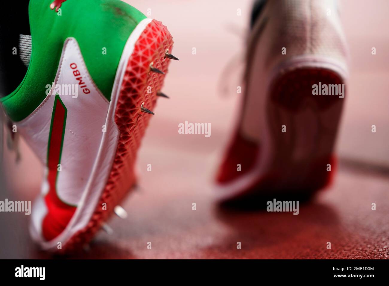 Spikes are seen on the cleats of Gianmarco Tamberi, of Italy, as he ...