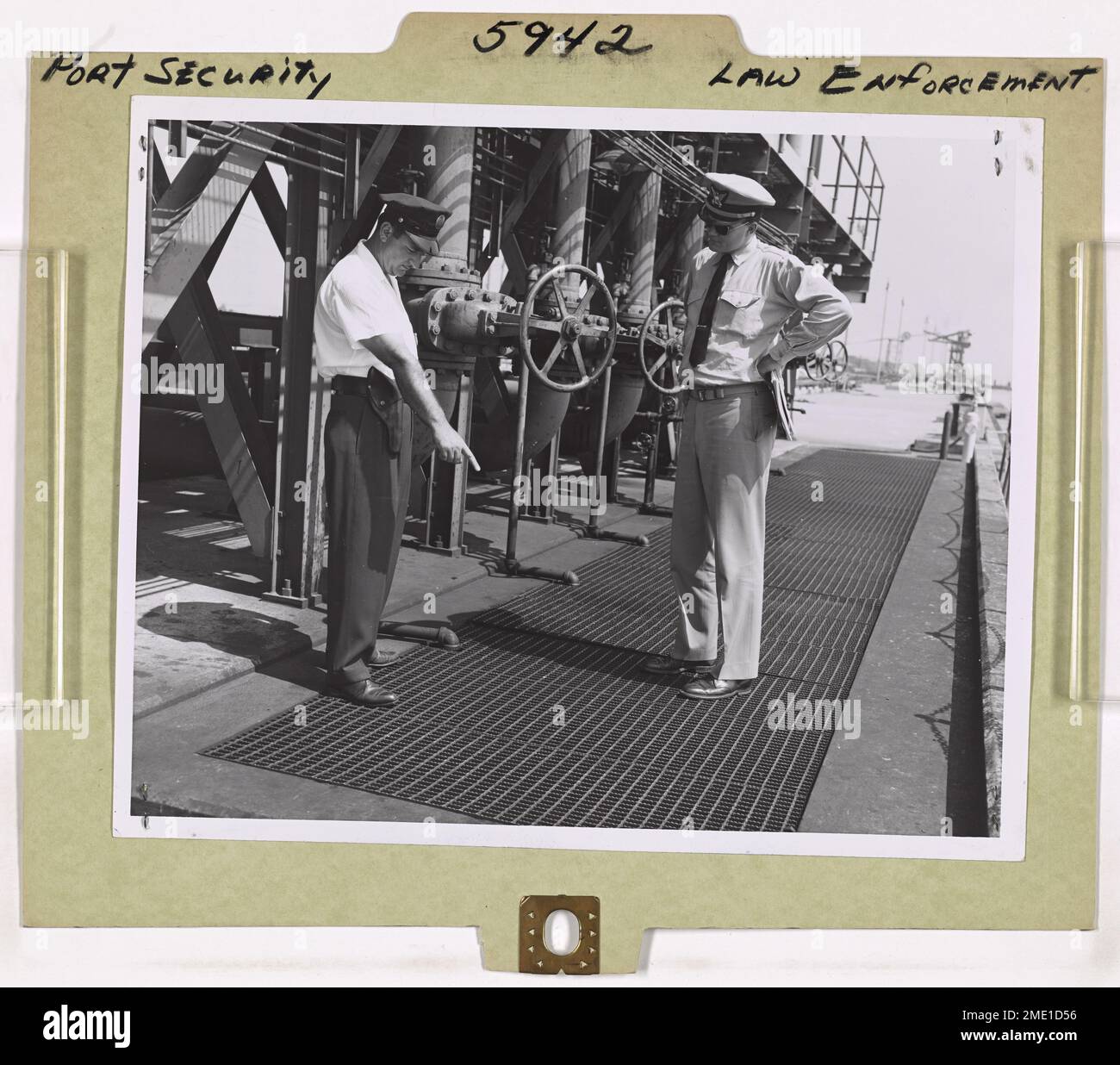 A Coast Guardsman inspects an oil dock in Philadelphia for potential ...