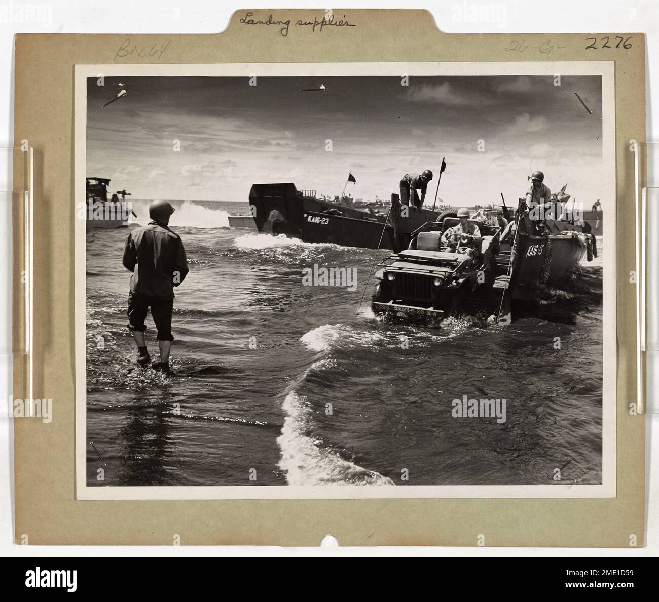 Landing Supplies at Cape Gloucester. New motorized equipment rolls down ...