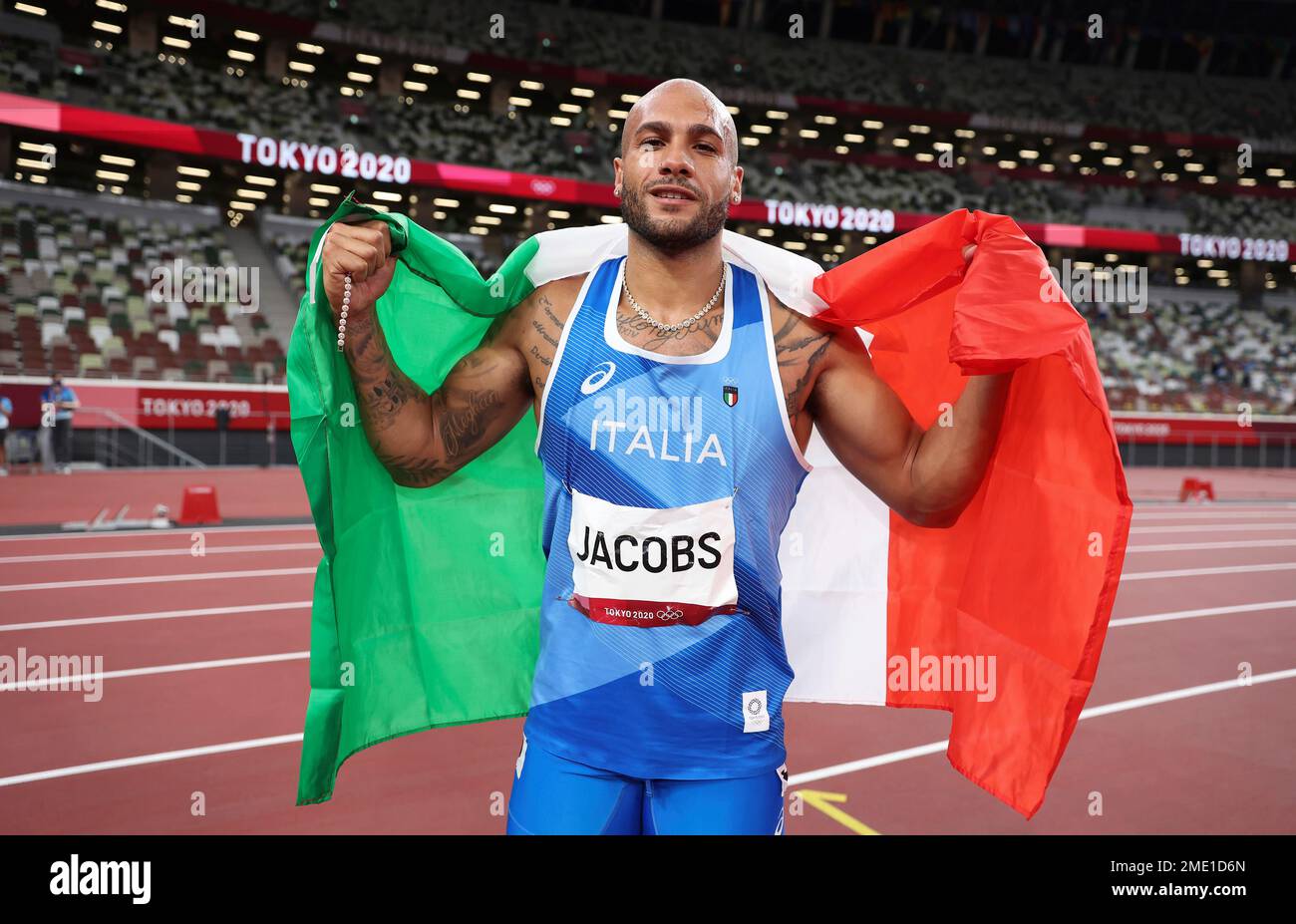 Lamont Marcell Jacobs of Italy celebrates after winning the gold medal ...