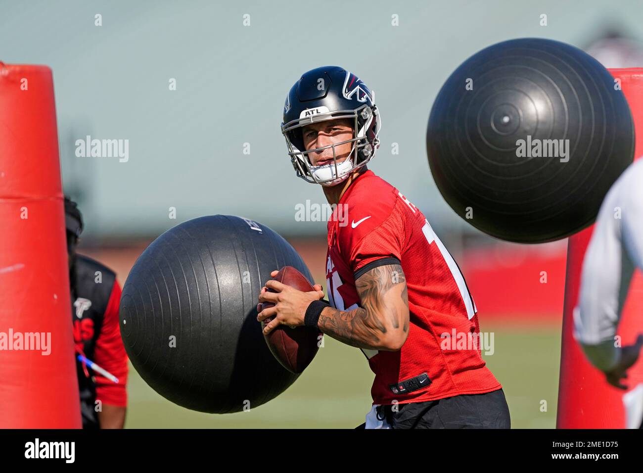 Atlanta Falcons quarterback Feleipe Franks (15) avoids exercise balls ...