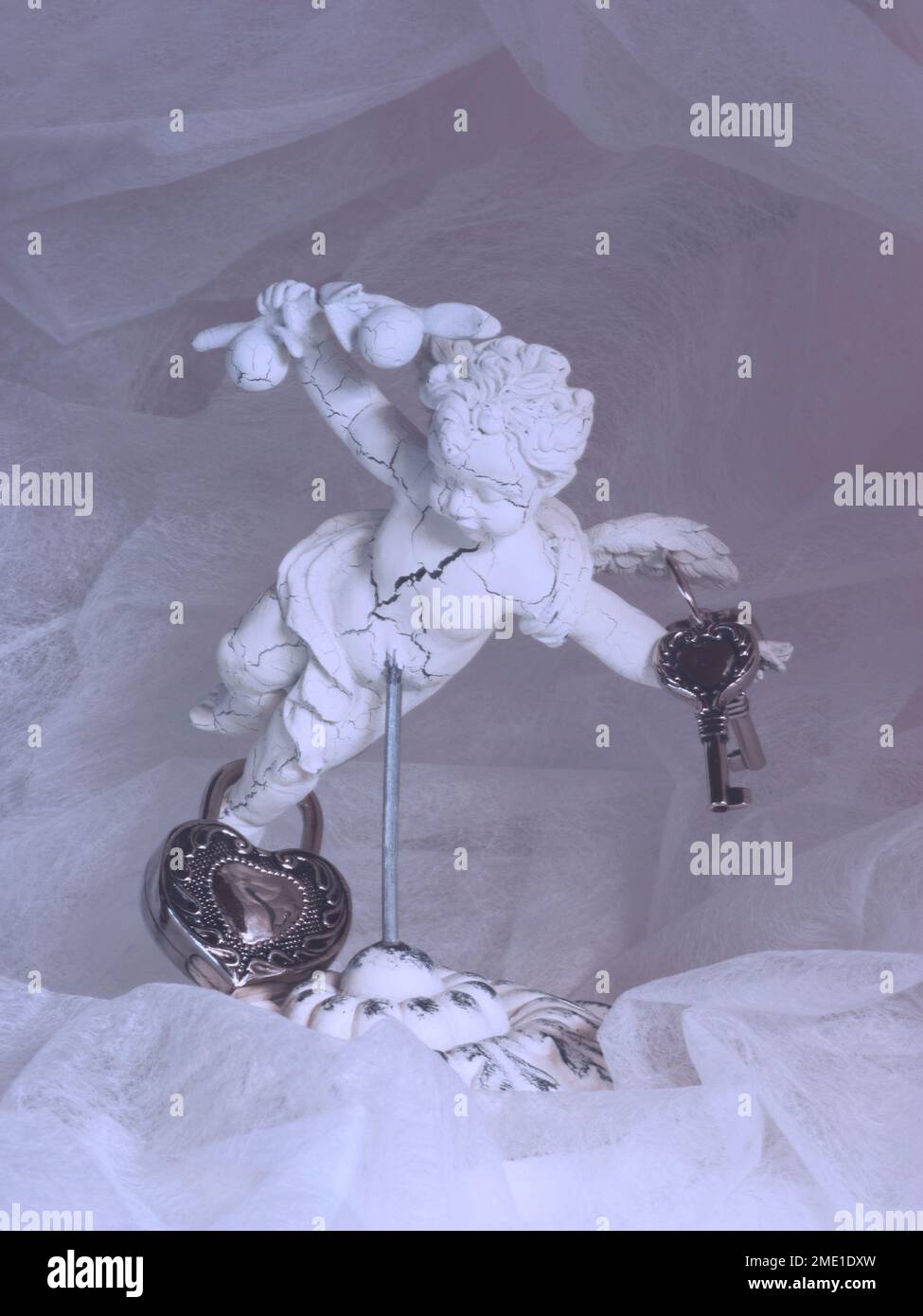 A cherub figure descends through white clouds of fabric delivering ...