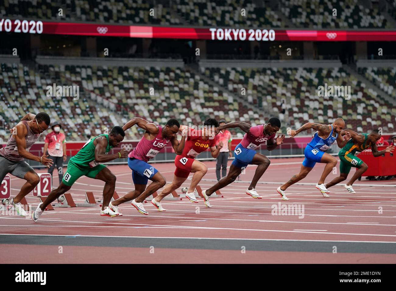 Competitors start in the final of the men's 100-meters at the 2020 ...