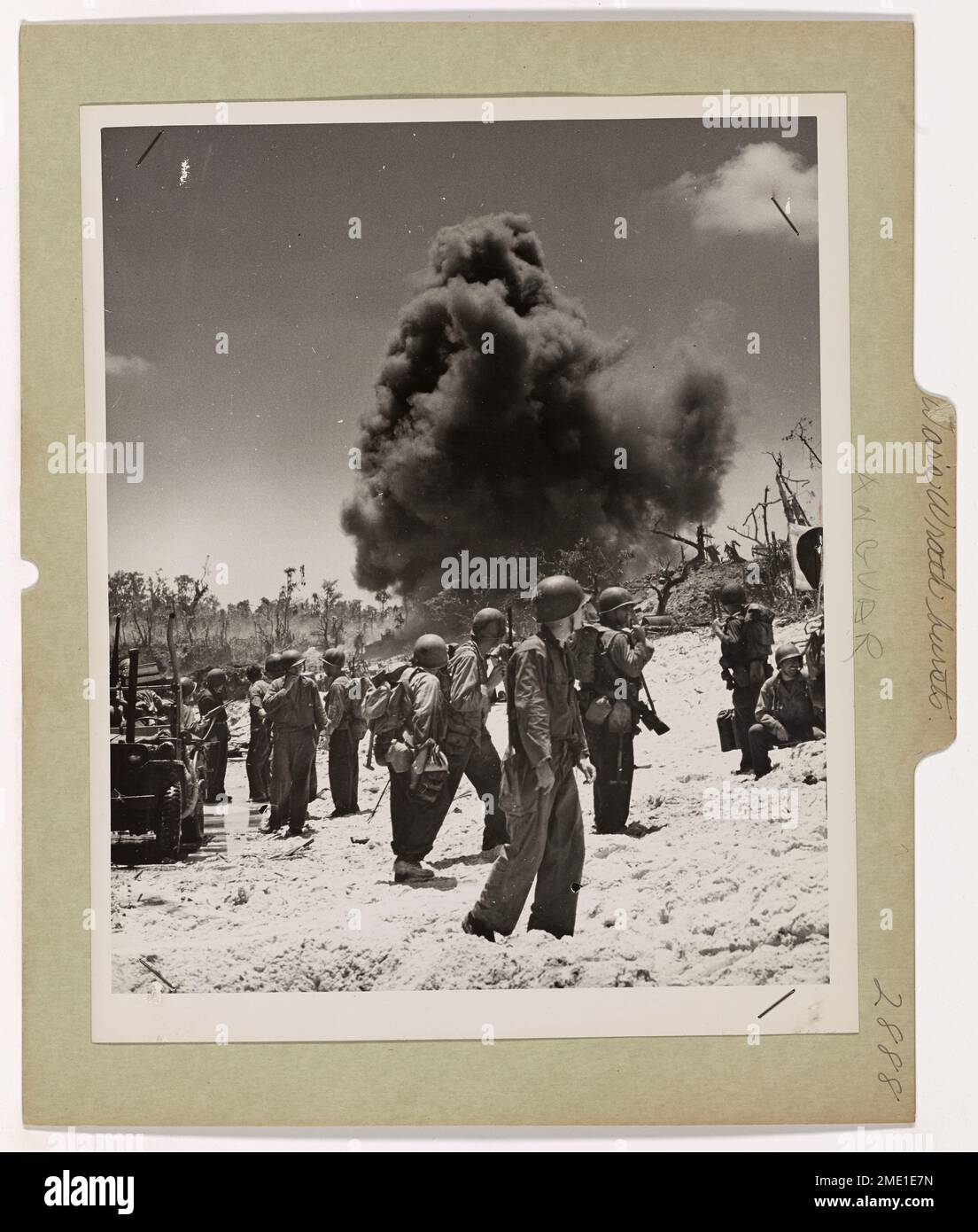 An explosion sends black smoke towering over the beachhead of Angaur ...