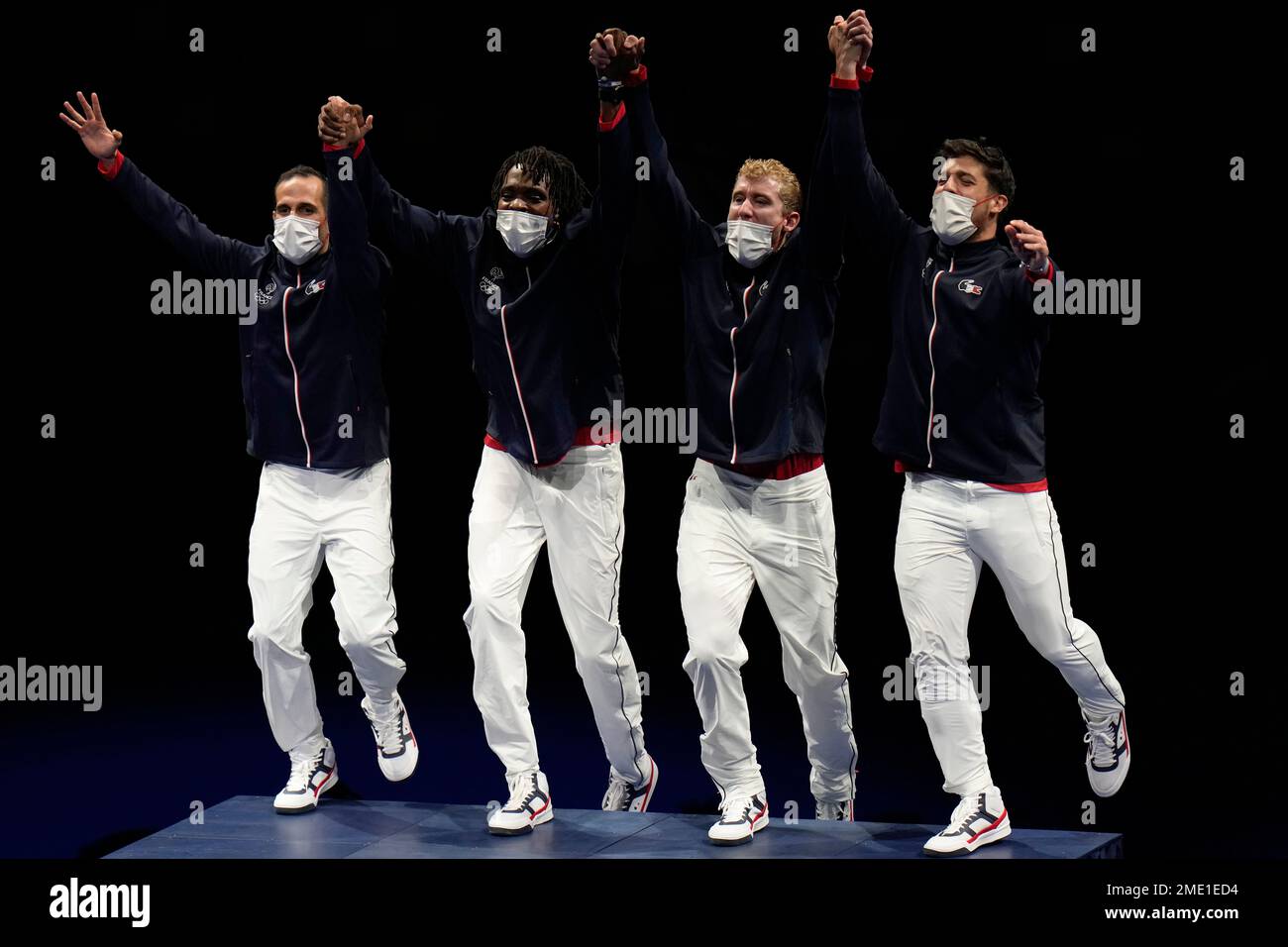 Gold medalists, France Foil team celebrates on the podium during the ...