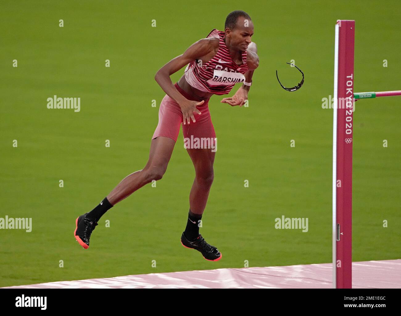 Mutaz Barshim, of Qatar, reacts after making a clearance during the ...