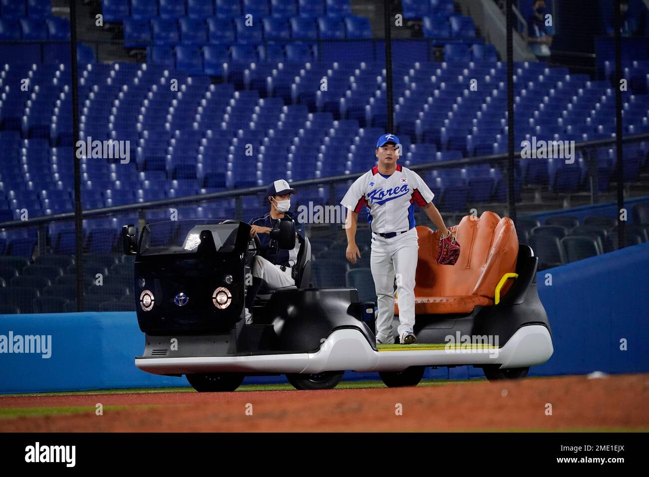 South Korea's Woosuk Go arrives to pitch in the seventh inning of a ...