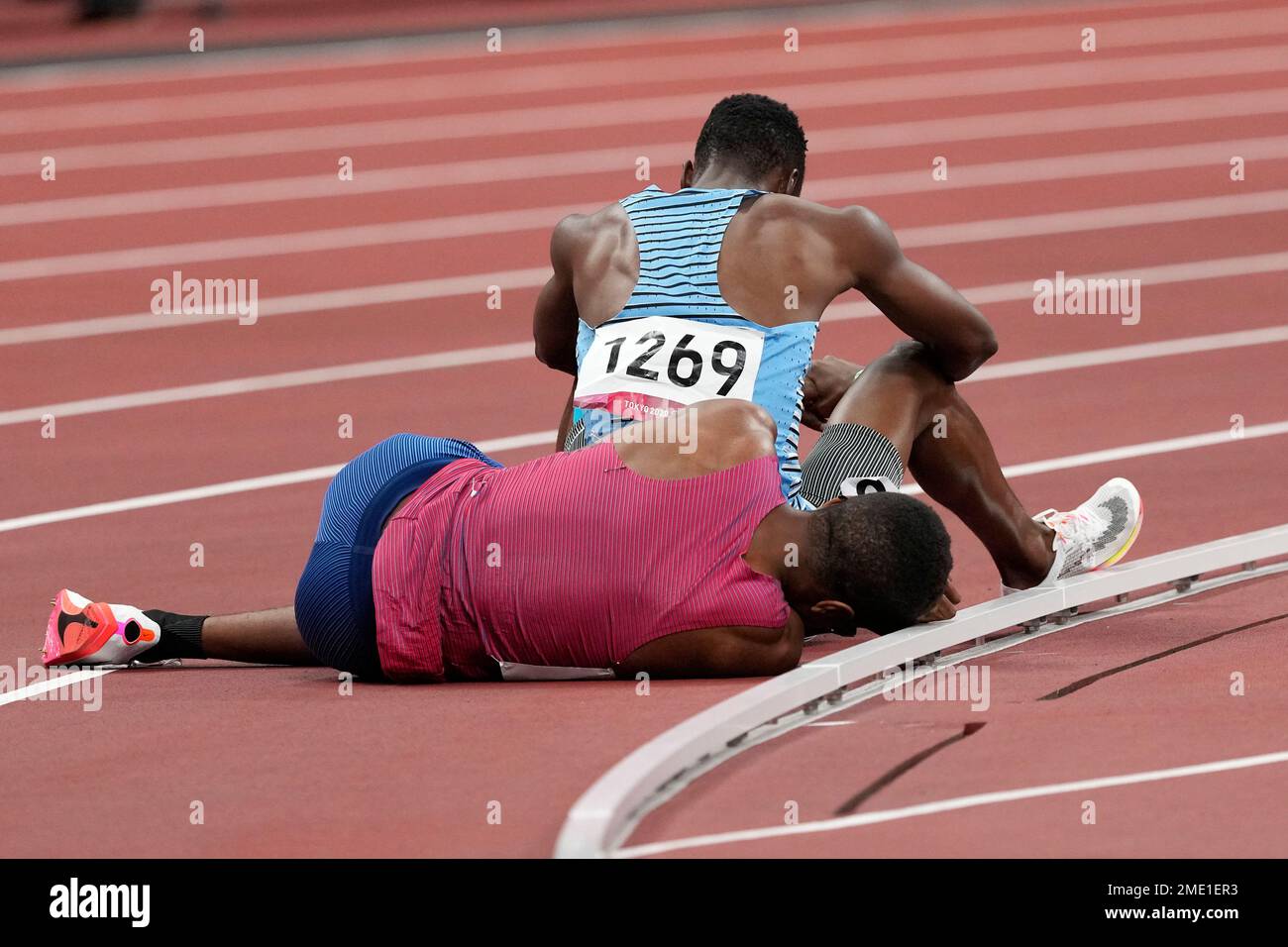 Isaiah Jewett, of the United States, and Nijel Amos, background, of ...