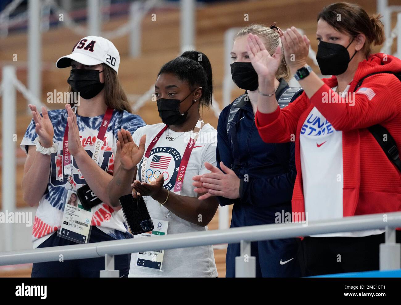Simone Biles of the United States, 2nd left, and teammates applaud as ...