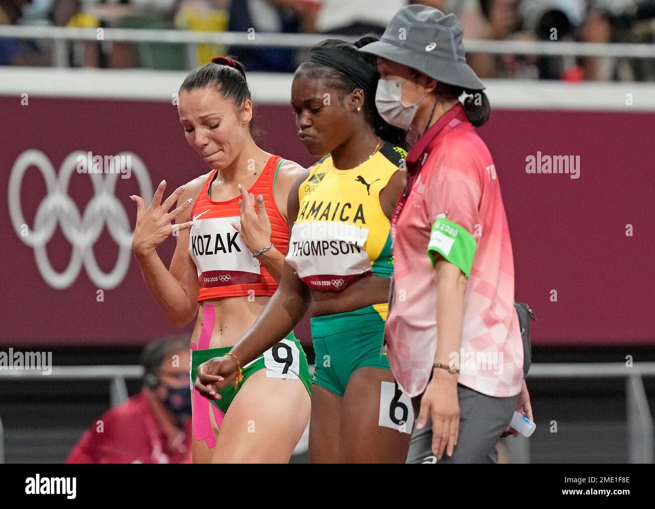 Luca Kozak, of Hungary, left, and Yanique Thompson, of Jamaica, center ...