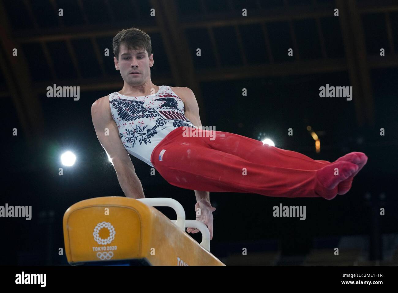 Alec Yoder of the United States, performs on the pommel horse during ...