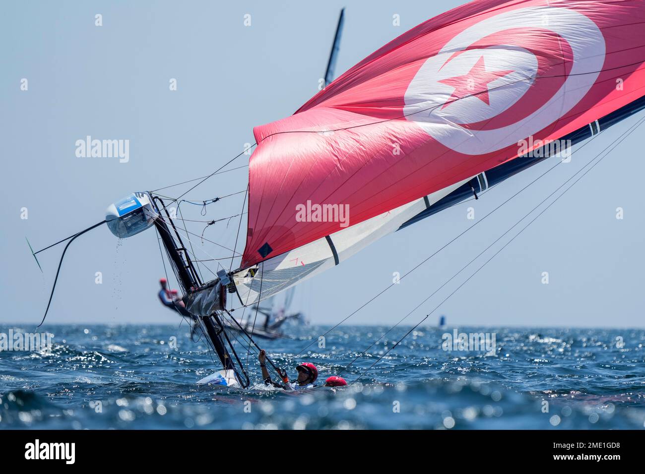 Tunisia's Mehdi Gharbi and Rain Rahali capsize during the Nacra race at ...