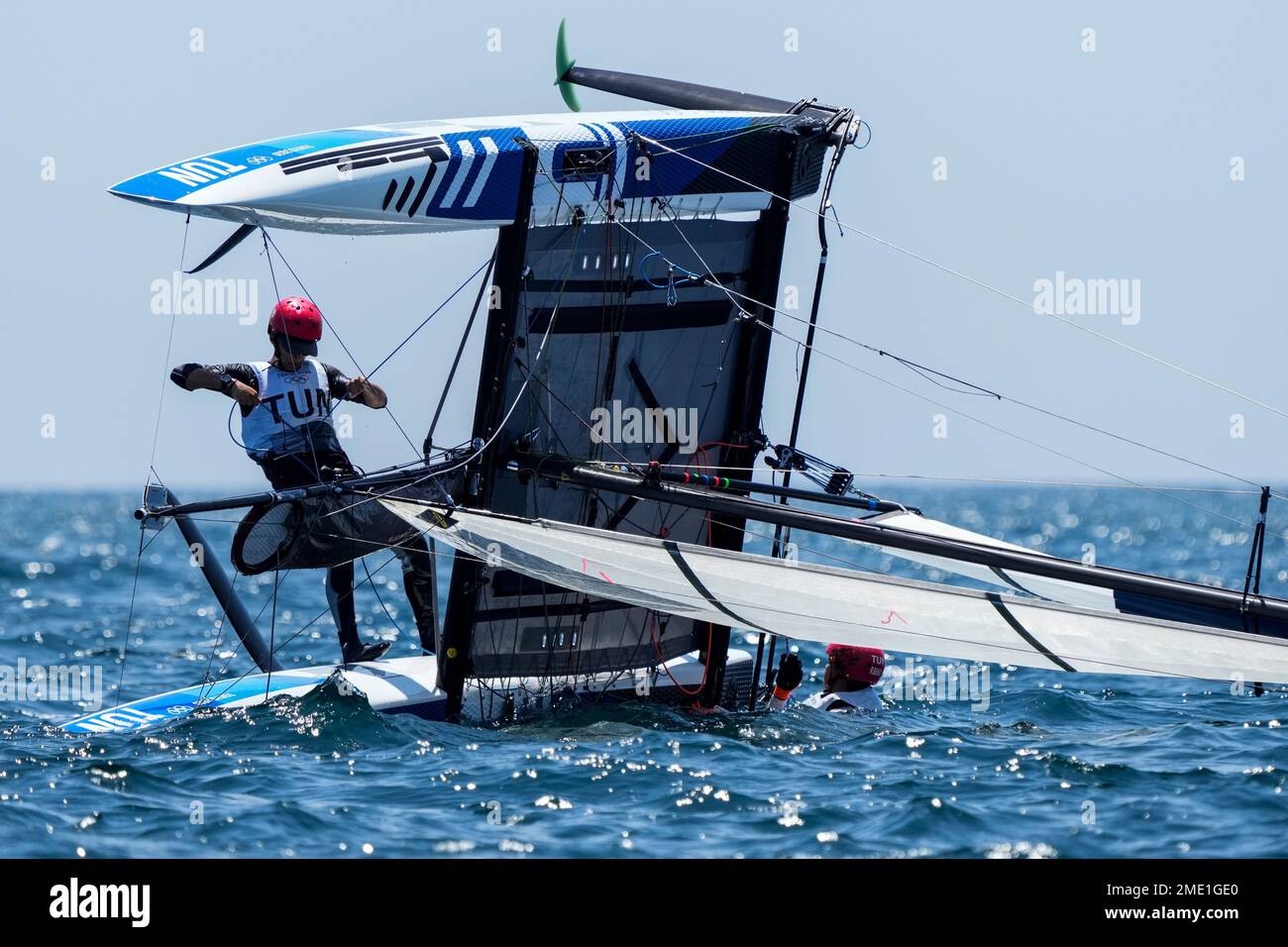 Tunisia's Mehdi Gharbi and Rain Rahali capsize during the Nacra race at ...