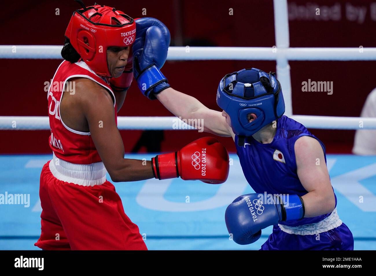 Columbia's Ingrit Lorena Valencia Vistoria, right, takes a punch from ...