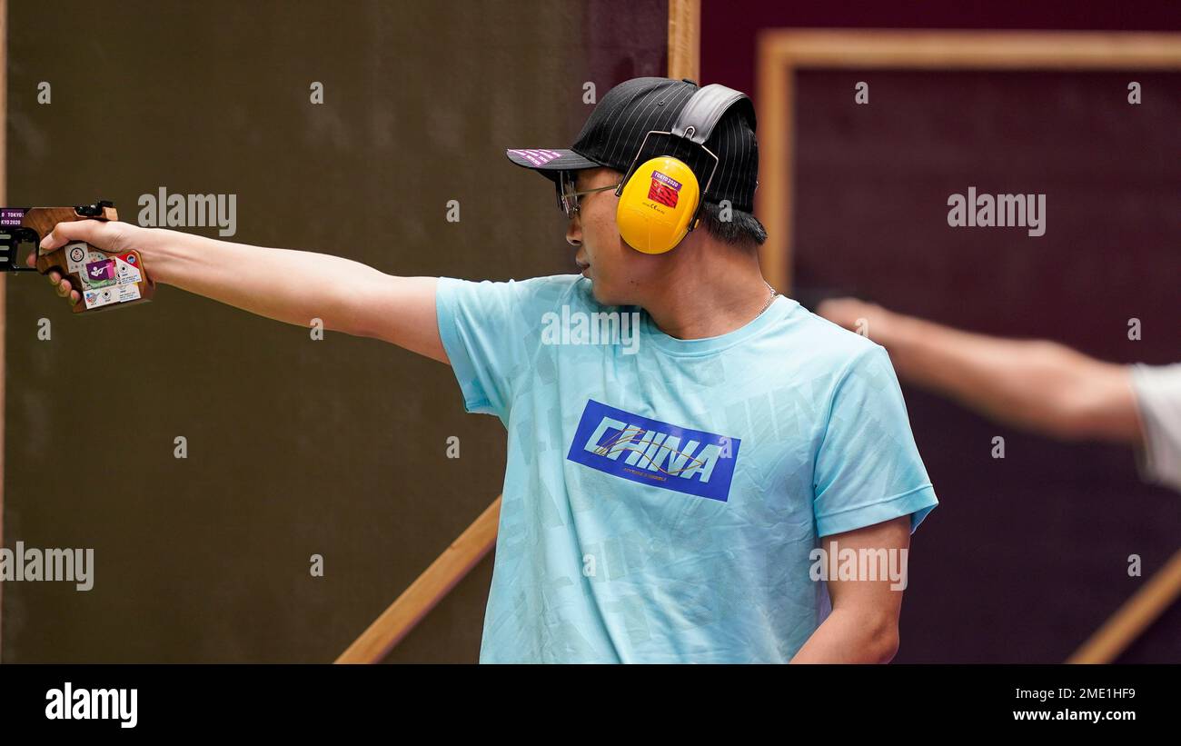 Li Yuehong, of China, competes in the men's 25-meter rapid fire pistol ...