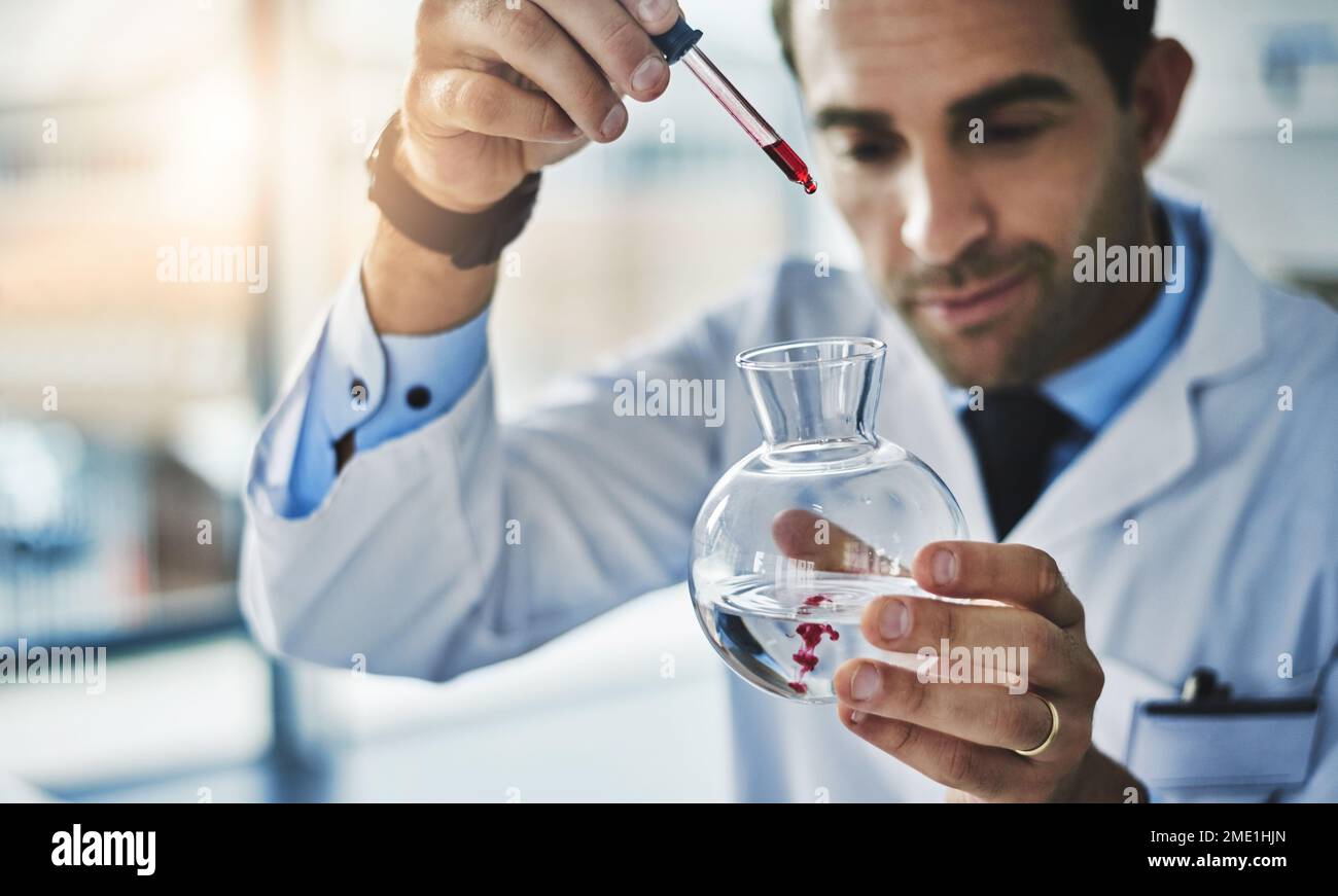 Time to test my theory. a scientist conducting an experiment in a lab ...