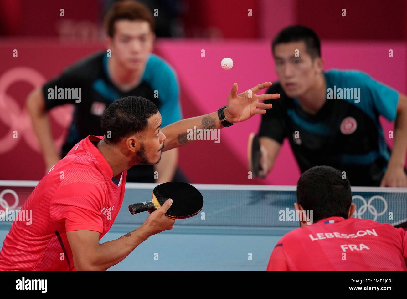 France's Alexandre Cassin, left, and Lebesson Emmanuel serve during the ...