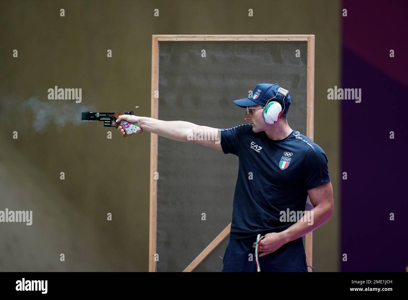 Tommaso Chelli, of Italy, competes in the men's 25-meter rapid fire ...