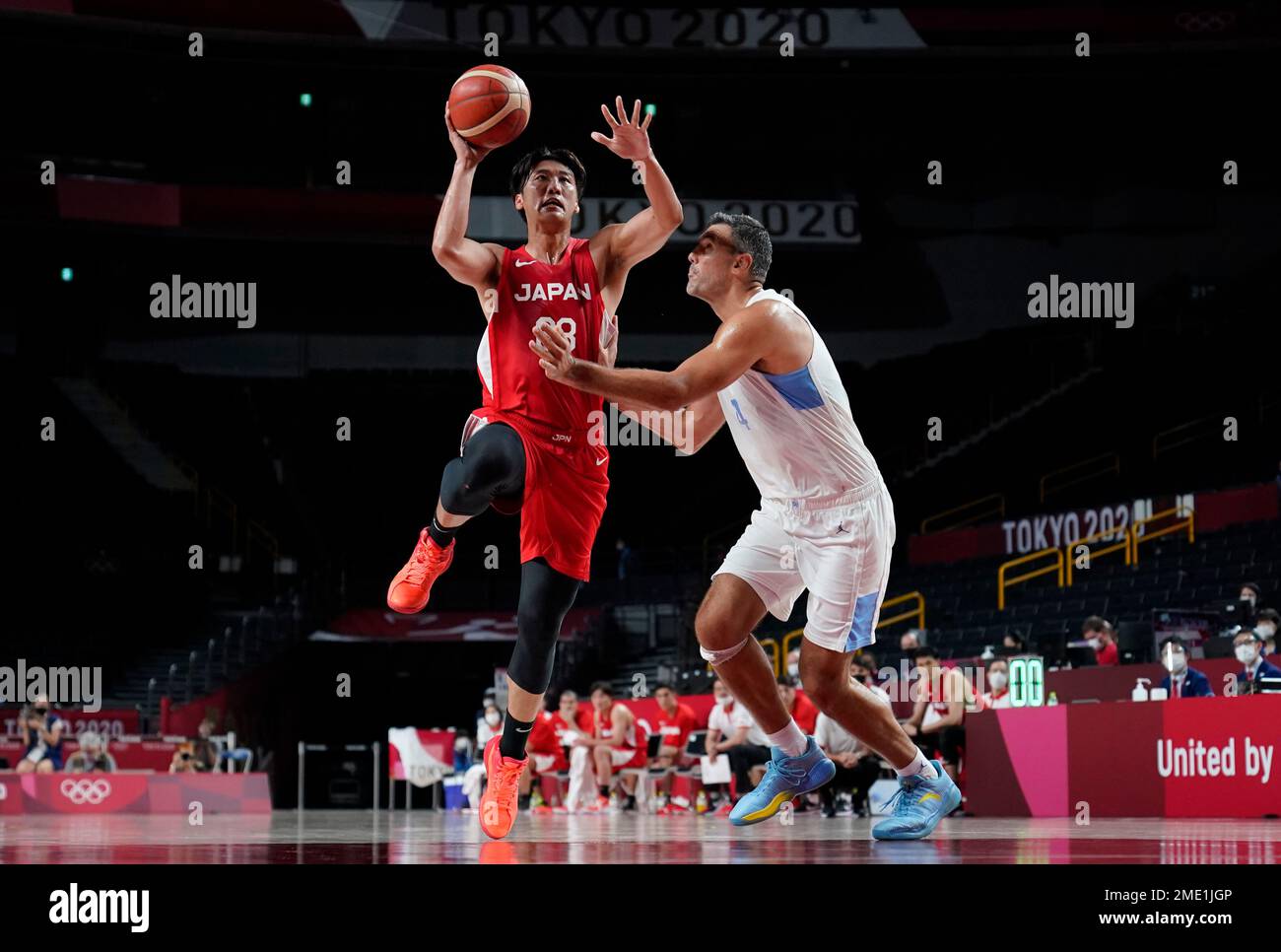 Japan's Tenketsu Harimoto (88), left, shoots over Argentina's Luis ...
